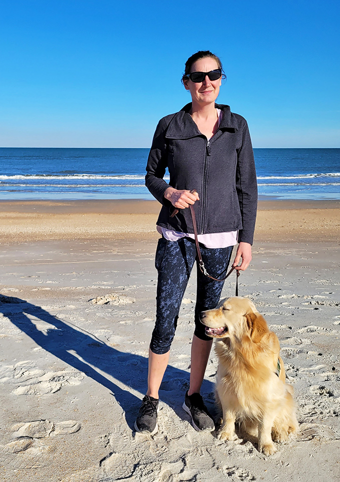 Golden retriever enjoying the morning sunshine on Anastasia State Park's pristine beaches, where leashed walks create perfect pet-friendly memories.