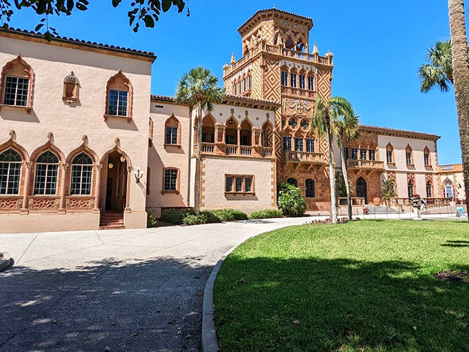 Ca' d'Zan's stunning Venetian-inspired architecture showcases intricate details and vibrant colors overlooking the sparkling waters of Sarasota Bay.