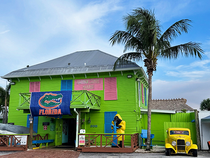The Old Key Lime House's unmistakable lime-green exterior pops against the blue Florida sky, announcing its unique character.