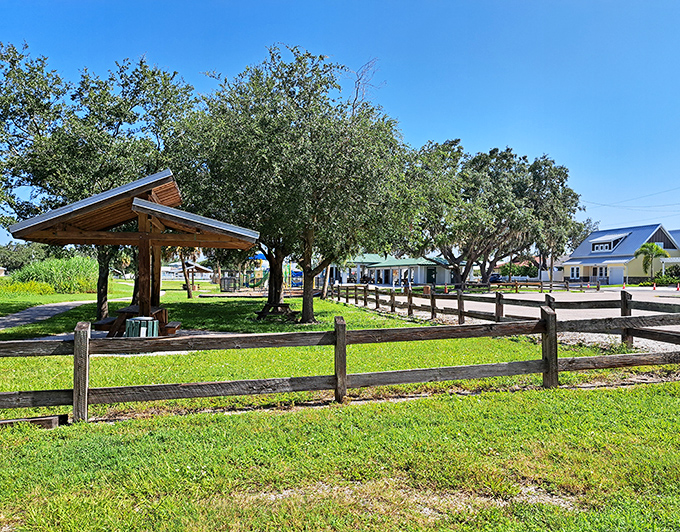 Rustic wooden fences and shady trees create the peaceful atmosphere of Pinecraft, where Amish traditions blend surprisingly well with Florida living.