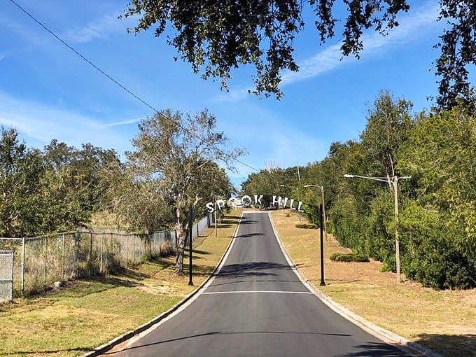 Spook Hill's simple road sign marks the spot where gravity apparently forgot how to work, or where a ghostly chief still protects travelers.