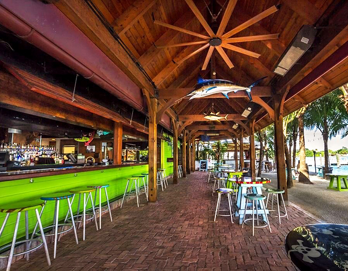 Wooden beams and hanging fish create authentic charm at this legendary Jupiter bar made famous in country music videos.