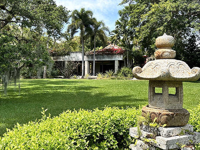 The Kampong's serene gardens feature stone lanterns and tropical plants, a hidden paradise in the heart of Miami.