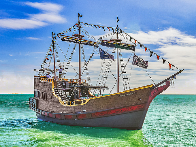 The Royal Conquest's vibrant red hull and multiple decks create the perfect playground for pirates of all ages in Madeira Beach.