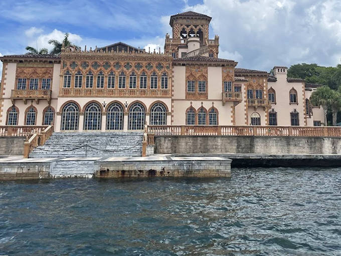 The mansion's grand waterfront fa&ccedil;ade reveals the lavish lifestyle of its original owners, with ornate balconies and terraces perfect for sunset viewing.