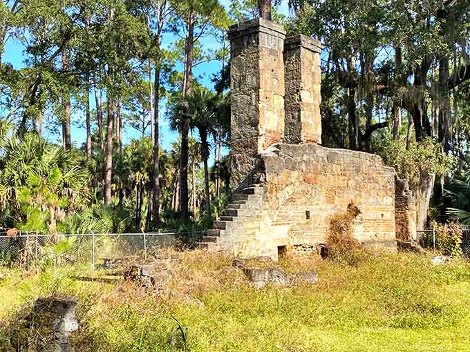 Arched doorways frame views of the forest that has grown up around this industrial ruin from Florida's plantation era.