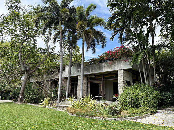 Modern architecture meets lush tropical landscaping at The Kampong, where concrete and nature create a harmonious retreat.