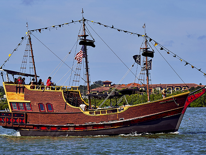 Colorful flags flutter from the masts of this impressive vessel as it prepares to set sail on another treasure-hunting expedition.