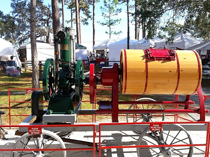 Antique engineering marvel! This vintage engine and barrel mixer once revolutionized farm work, now preserved as mechanical poetry from a bygone era.
