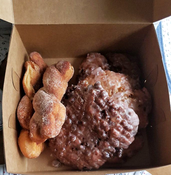 The holy trinity of fried dough: apple fritters, pineapple fritters, and sugar twists that would make your dentist weep and your taste buds rejoice.