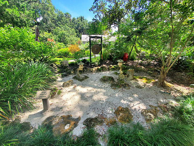 The Asian-inspired garden area where someone decided that Zen principles and gnome villages could peacefully coexist, and honestly, they were absolutely right about that.