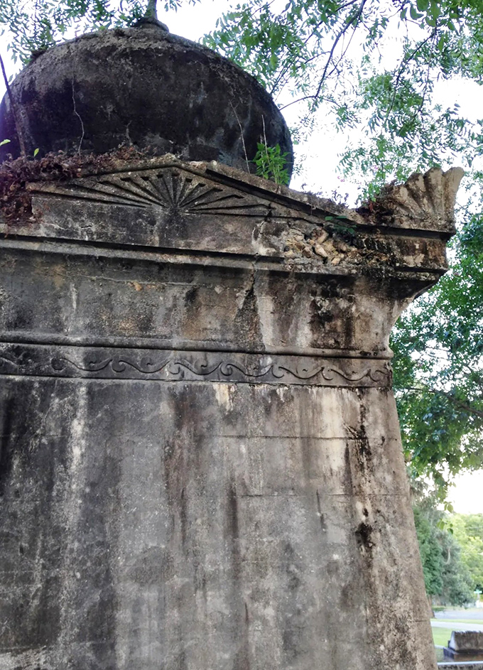 Time and elements have left their mark on the structure's backside, nature slowly reclaiming what man has built with patient persistence.