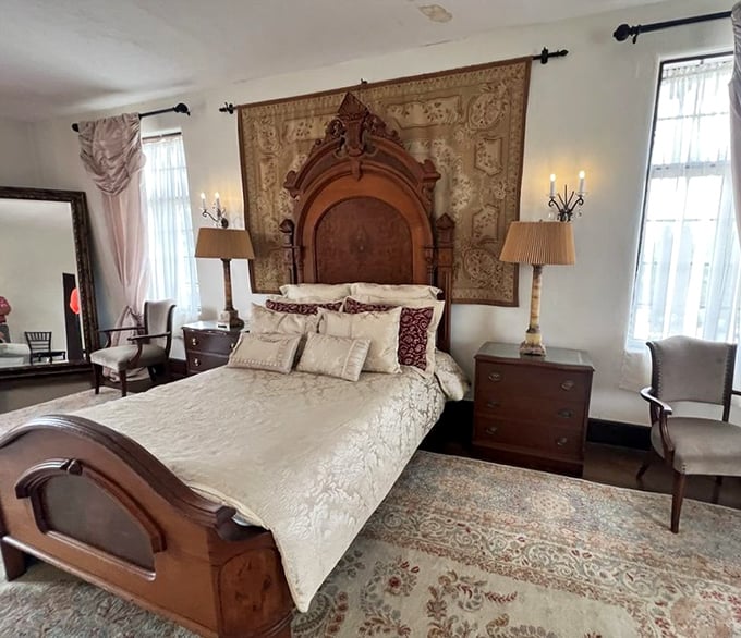 Sleep like a 1920s socialite in this elegant bedroom, where antique furnishings and rich textiles transport you to another era.