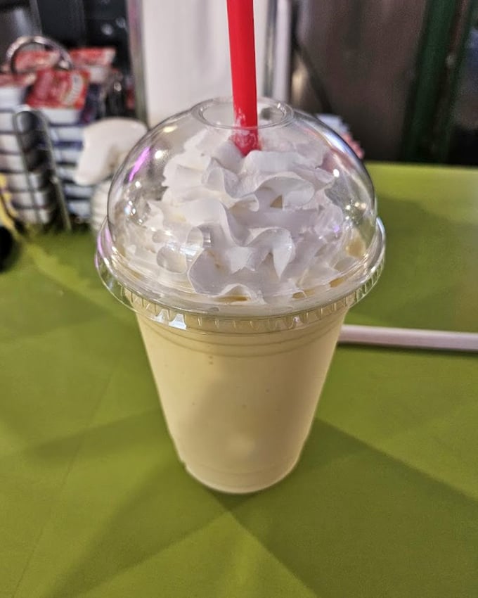 This blueberry milkshake stands at attention &ndash; the straw test is the true measure of milkshake excellence.