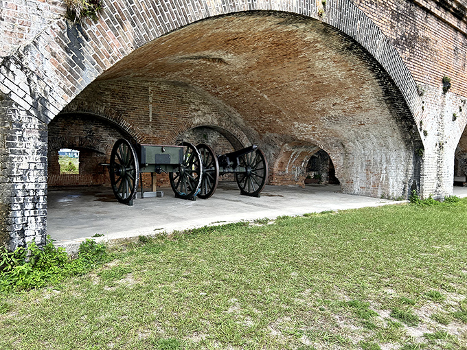 Sunlight plays through these brick archways like nature's own spotlight, illuminating passages where soldiers once stood guard.