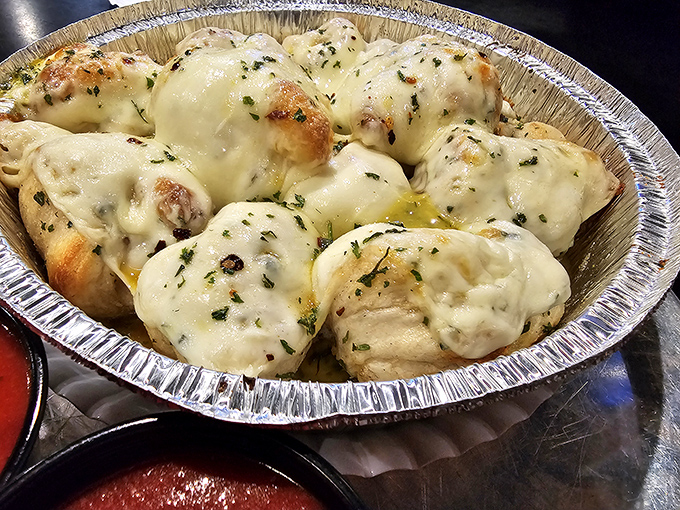 These cheesy garlic knots aren't just appetizers &ndash; they're little pillows of garlicky heaven that might upstage the main event.