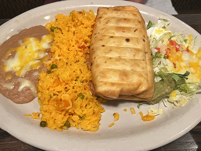 What happens when a burrito takes a luxurious oil bath &ndash; crispy exterior giving way to tender filling alongside festive rice.