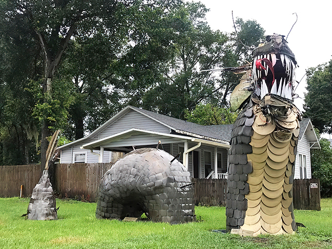 A close-up reveals the intricate metalwork that forms the dragon's fearsome visage, each piece of scrap metal finding new purpose in this artistic resurrection.