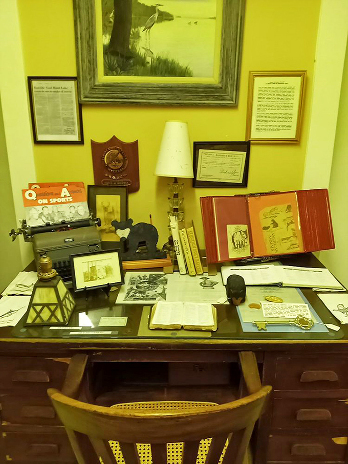 A writer's desk frozen in time &ndash; complete with typewriter, lamp, and scattered papers &ndash; as if its occupant just stepped away for a cup of coffee.