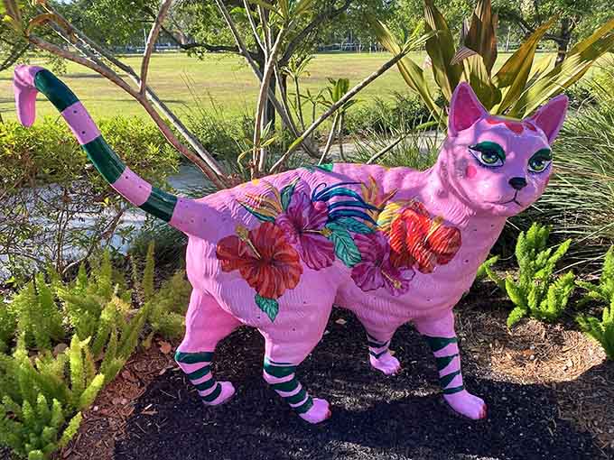 A pink cat with floral patterns proves that nature's palette has nothing on a sculptor's imagination and sense of fun.