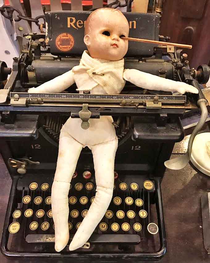 This little nightmare fuel looks ready to type out your deepest fears. Sleep tight, don't let the vintage dolls write about you!