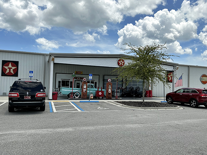 The museum's exterior might seem unassuming, but those vintage gas pumps are just appetizers for the automotive feast inside.