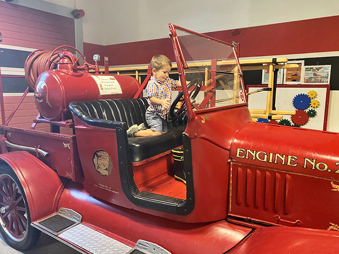 Every child's dream job comes to life as young firefighters climb aboard this vintage engine, ready to save the day.
