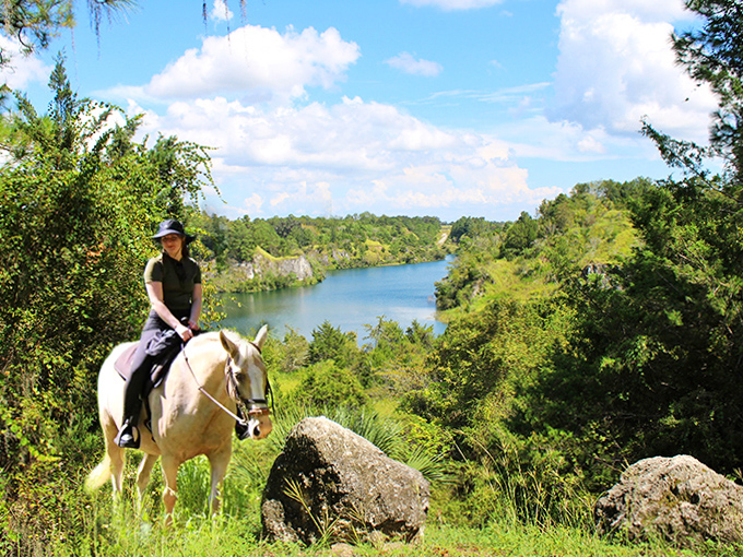 Perched between earth and sky, riders discover impossibly blue waters nestled between limestone walls millions of years in the making.