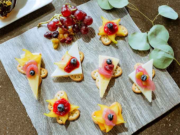 Cheese and fruit arranged so artfully you'll feel guilty eating it for approximately three seconds before diving in like a civilized barbarian.