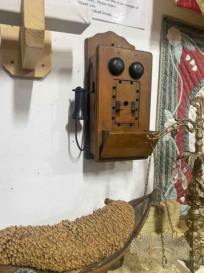 An antique wall-mounted telephone reminds visitors when "going viral" meant you caught the flu from your neighbor.