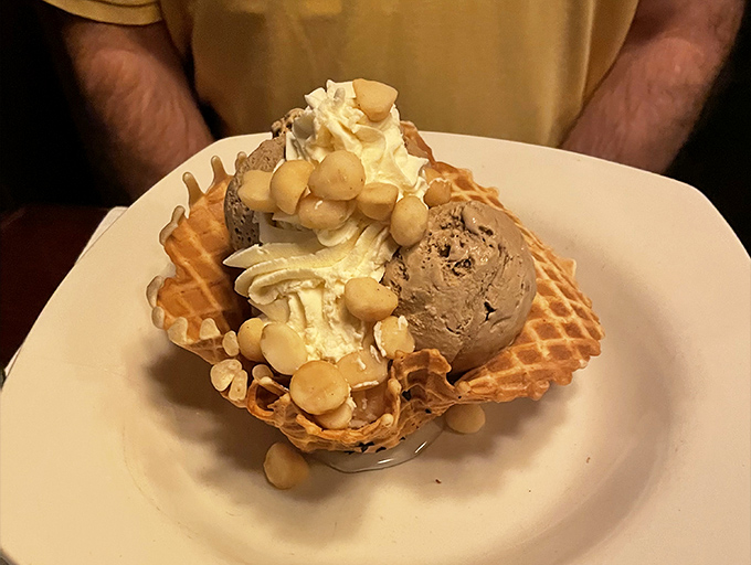 Macadamia Nut Sundae: where waffle cone architecture meets ice cream engineering in a monument to nutty indulgence that defies gravity.