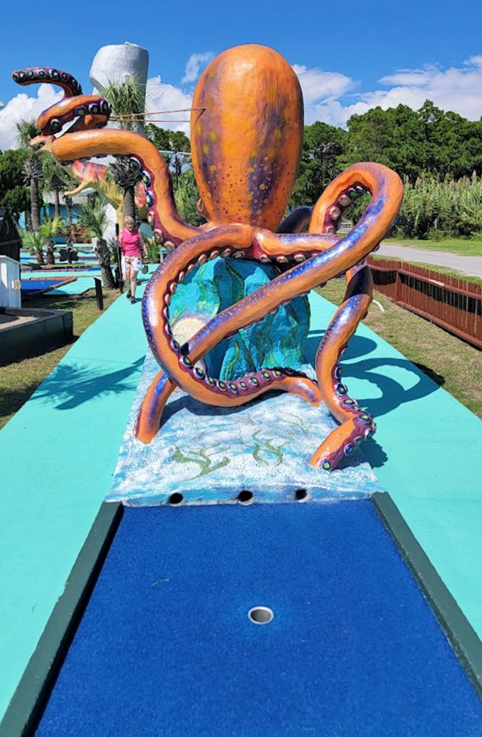 The octopus obstacle reaches tentacles across the blue fairway, as if trying to hug your golf ball into submission.