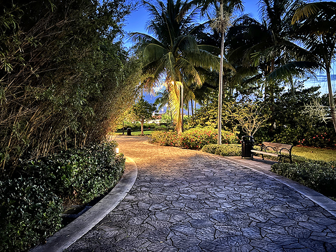 Pathway: Manicured tropical gardens lead visitors toward bronze greatness. Even the walkway feels like part of an epic journey.