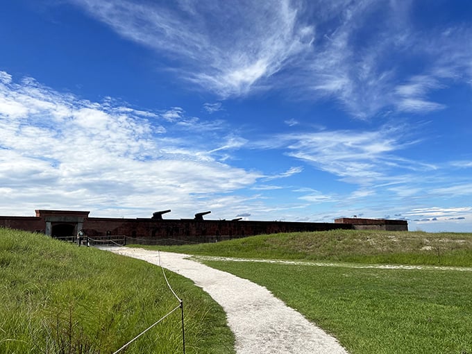 The winding pathway beckons visitors deeper into the fort's mysteries, each step revealing another layer of America's military past.