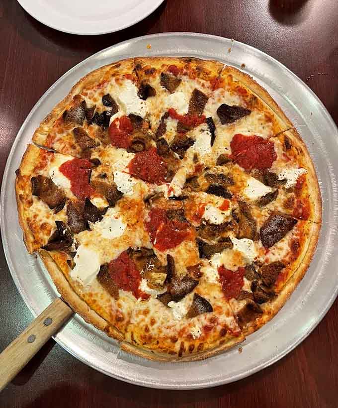 Specialty pizzas like this one show that Pino's can handle creative combinations without losing sight of fundamentals.