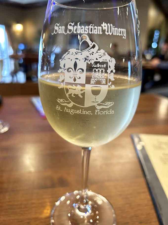 San Sebastian's signature white wine catches the light beautifully, promising refreshment in every elegant sip you take.