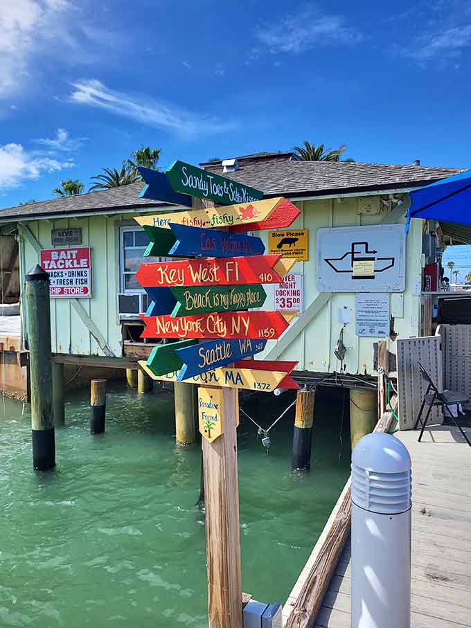 Every beach needs a whimsical signpost reminding you that paradise isn't measured in miles but in the distance from your daily worries.