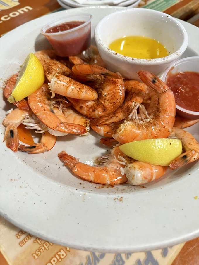 Peel-and-eat shrimp arrive perfectly seasoned, requiring nothing more than a quick dunk in cocktail sauce to achieve shellfish nirvana.