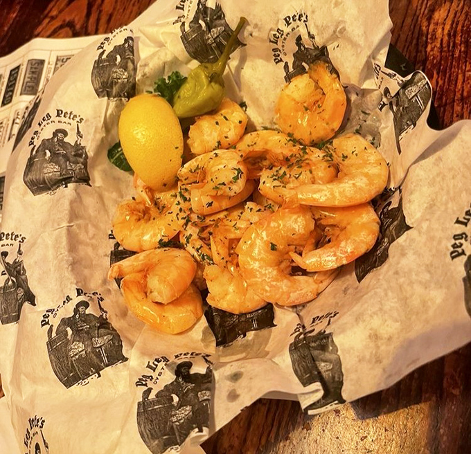 Gulf shrimp, plump and perfectly cooked, nestled on branded paper &ndash; proof that sometimes the simplest preparations yield the most pleasure.