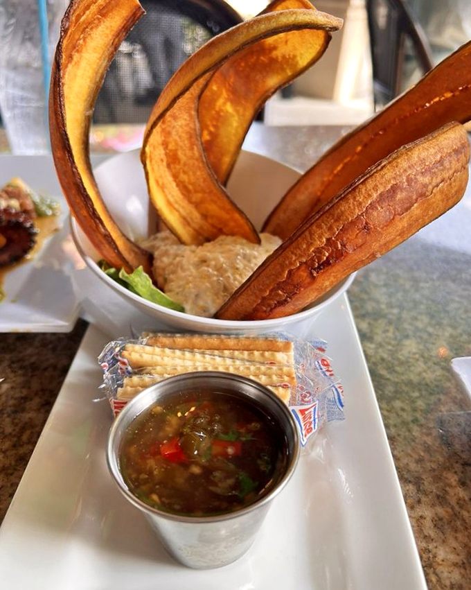 Sail-like plantain chips stand tall around creamy smoked fish dip &ndash; a nod to Hemingway's beloved fishing adventures in Florida waters.