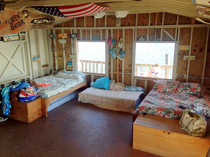 Simple beds line the walls of this floating bunkhouse, where dreams are serenaded by gentle Gulf waters below.