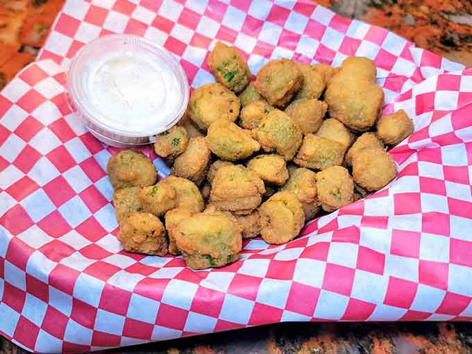 Golden fried pickles deliver that perfect crunch and tang, making them dangerously easy to devour before your main arrives.