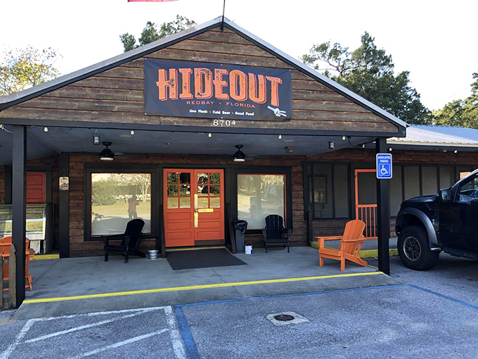 The Hideout: Rustic charm meets hearty comfort food at this local favorite where wooden walls and red doors welcome hungry travelers.