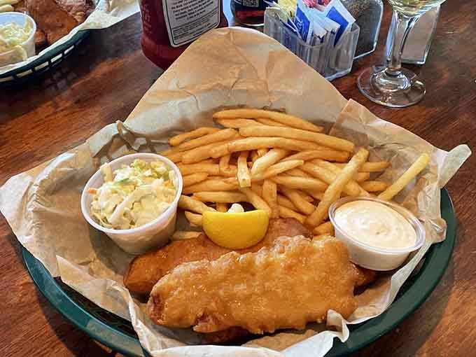 Fish and chips done right: golden, crispy, and paired with fries that could make you forget about the sunset (but only briefly).