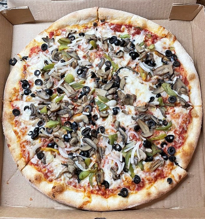 Garden-fresh toppings transform this veggie pizza into a produce paradise &ndash; proof that vegetarian options needn't be an afterthought.