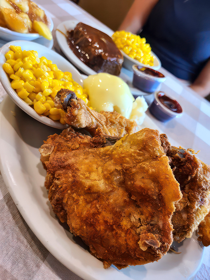 Golden fried fish with fries piled high and coleslaw on the side—this is the kind of meal that requires loosening your belt preemptively.