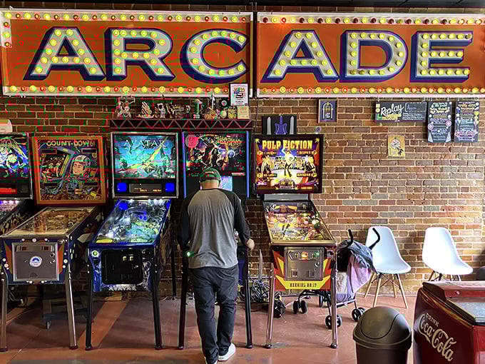 Under the warm glow of the "ARCADE" sign, visitors rediscover the simple joy of gaming without updates, downloads, or subscription fees.