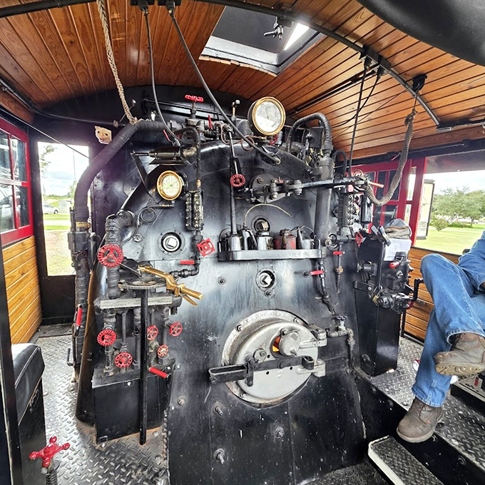 The locomotive's control panel resembles a mechanical symphony, with gauges, valves, and levers that once danced under skilled hands.