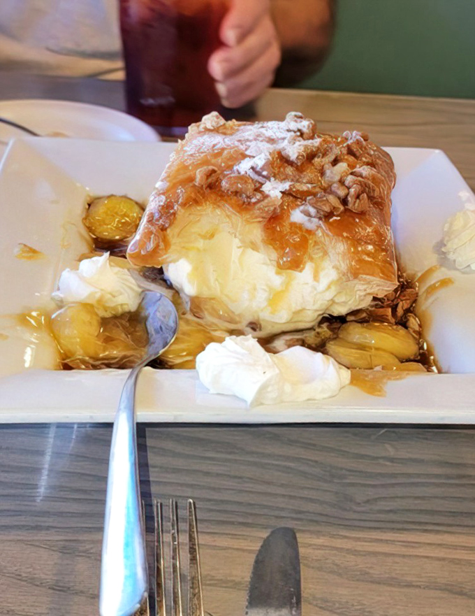 The legendary Banana Foster in all its glory&mdash;where warm caramel sauce cascades over ice cream like a sweet waterfall of happiness.