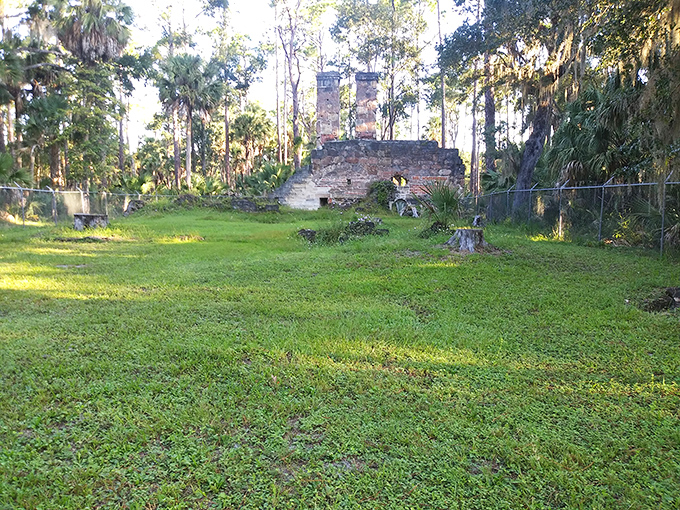 An open field surrounds the ruins, creating a stage where history's ghosts might still perform their daily routines.